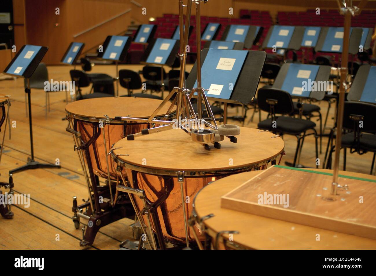 Timpani and music stands on the stage of a concert hall Stock Photo - Alamy