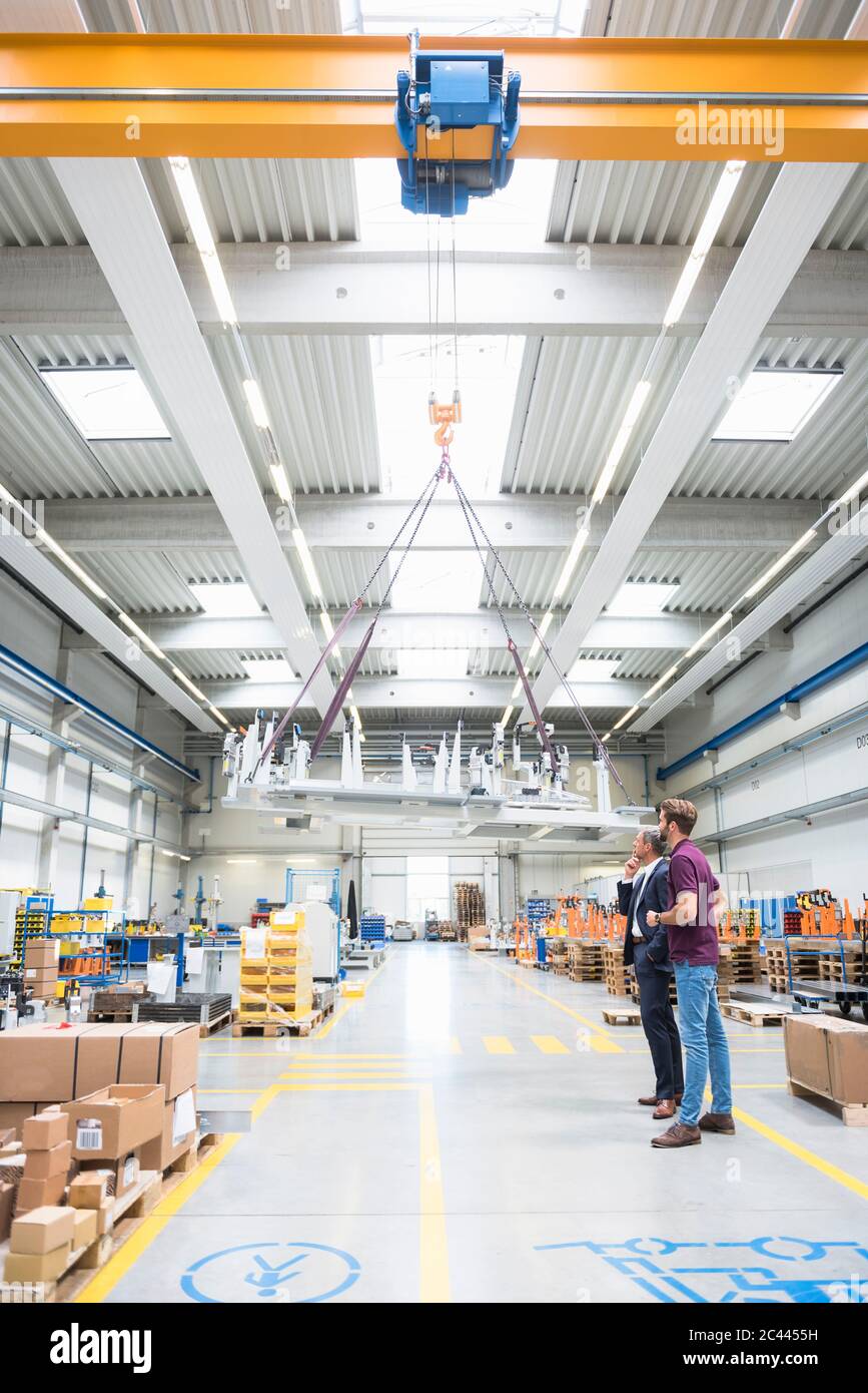 Crane with men hi-res stock photography and images - Alamy