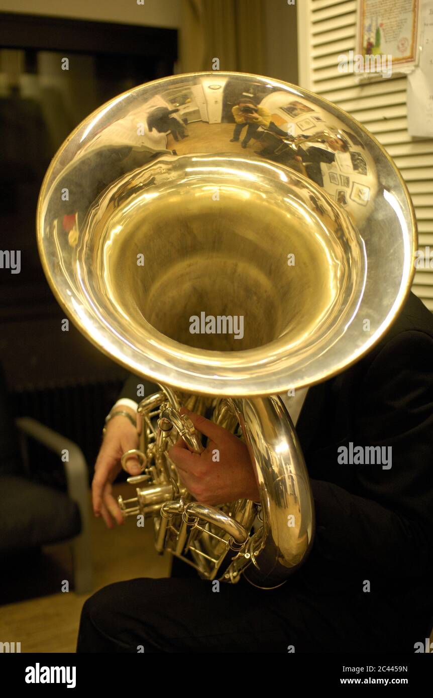Sitting man with tuba Stock Photo - Alamy
