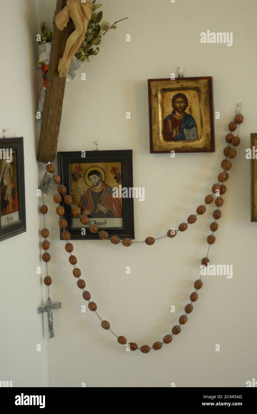 Christian images of saints on a wall Stock Photo - Alamy