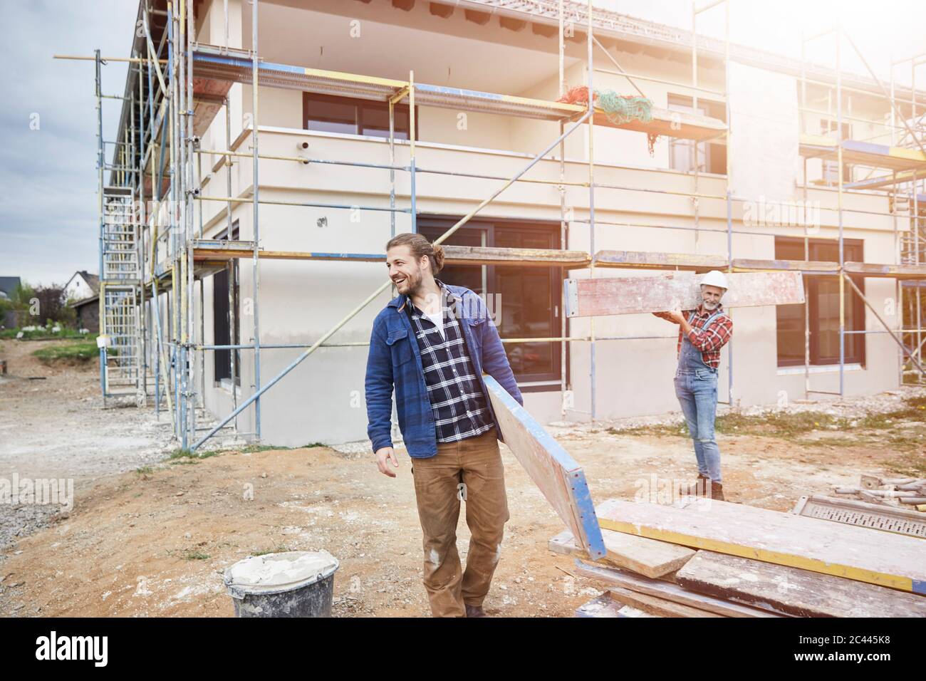Construction workers working at construction site Stock Photo - Alamy