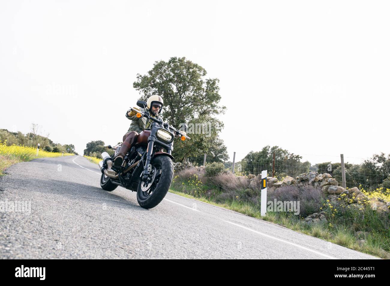 Biker Riding Motorcycle Low Angle High Resolution Stock Photography and ...