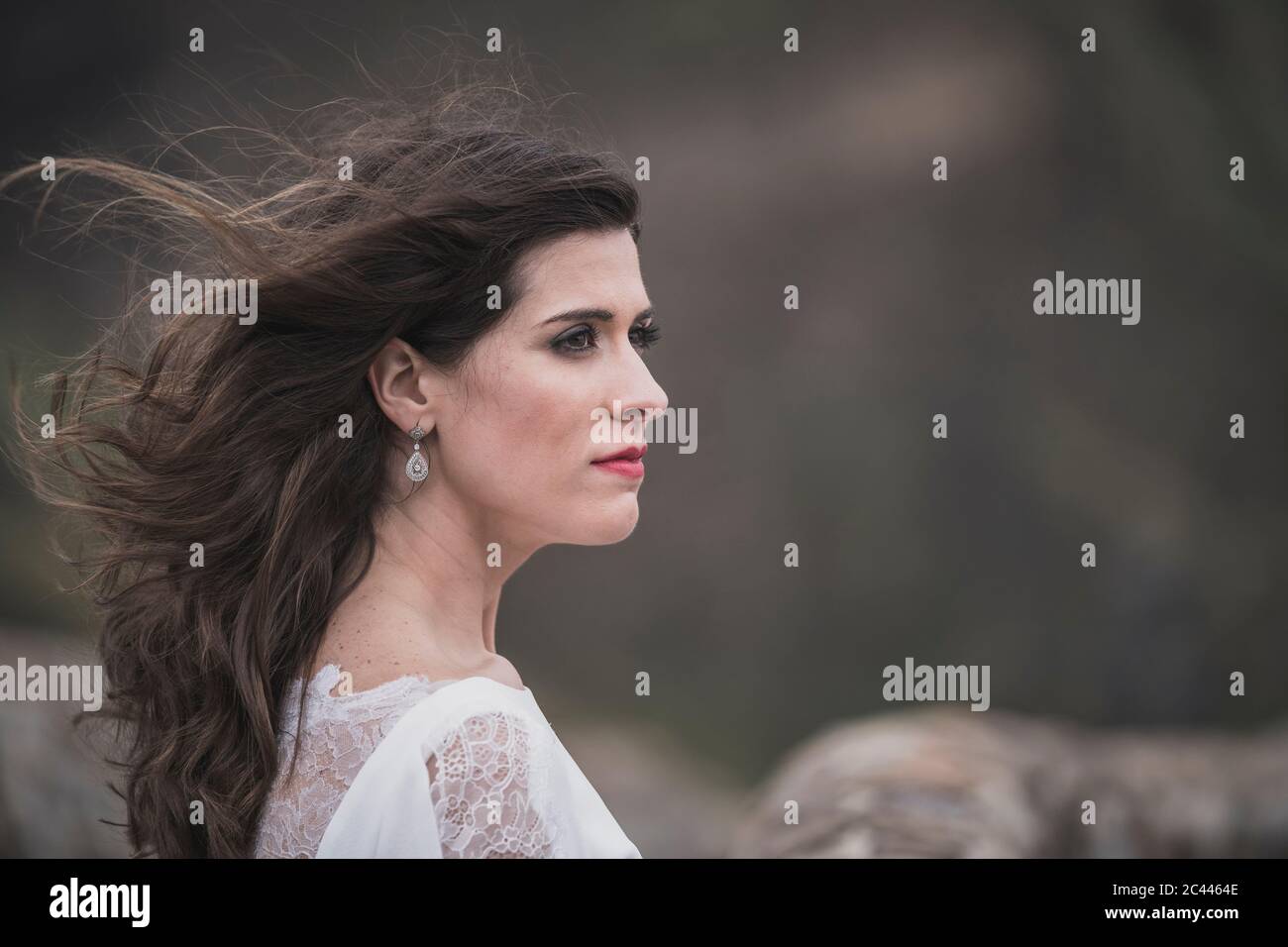 Portrait of bride looking sideways Stock Photo - Alamy
