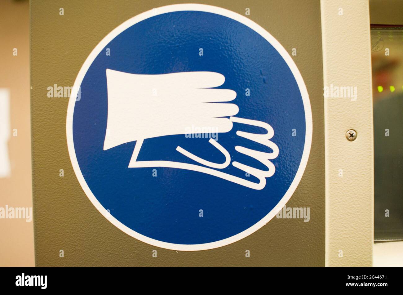 Pictogram with safety gloves in a factory Stock Photo - Alamy