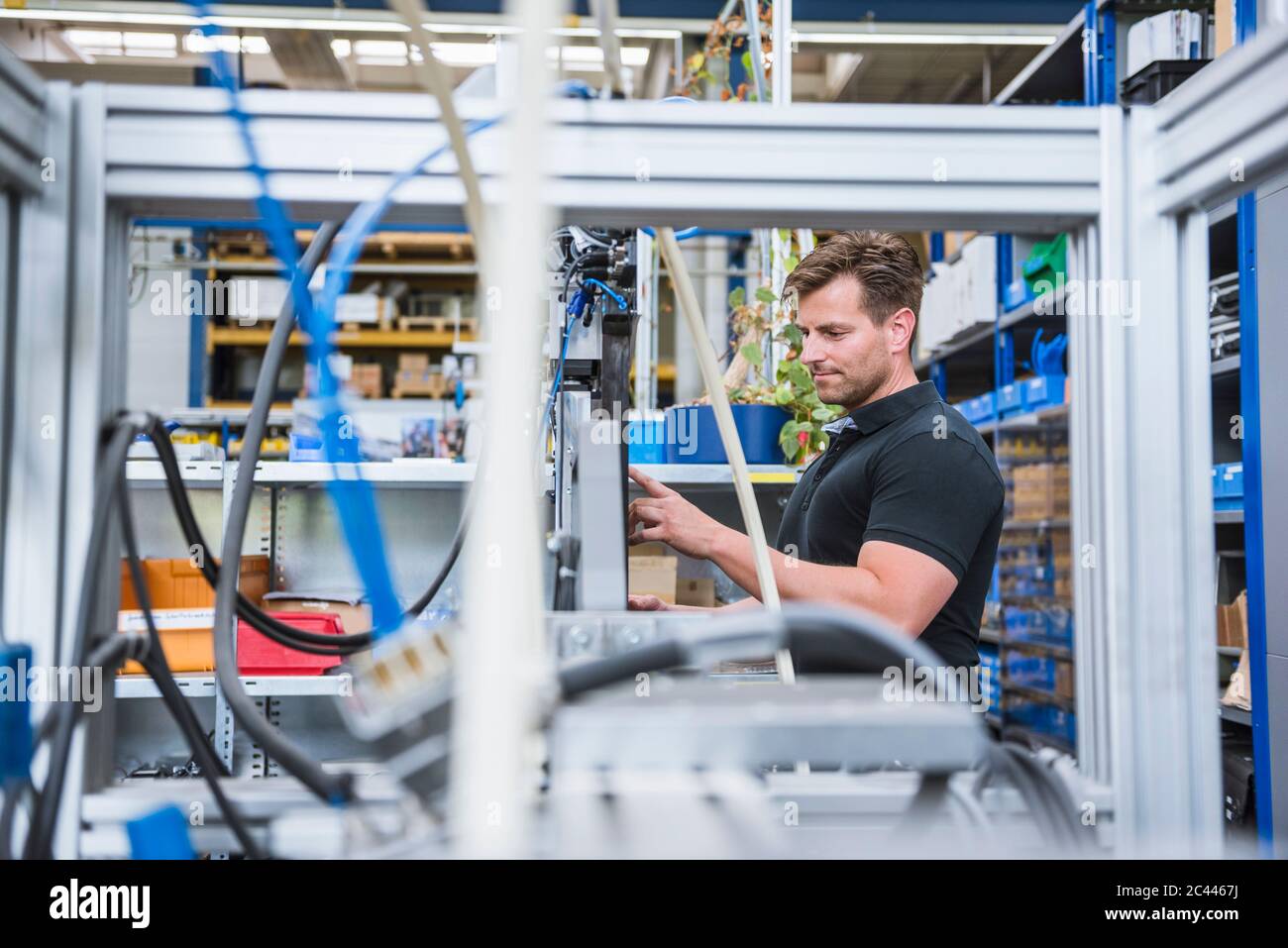 Operating a machine hi-res stock photography and images - Alamy