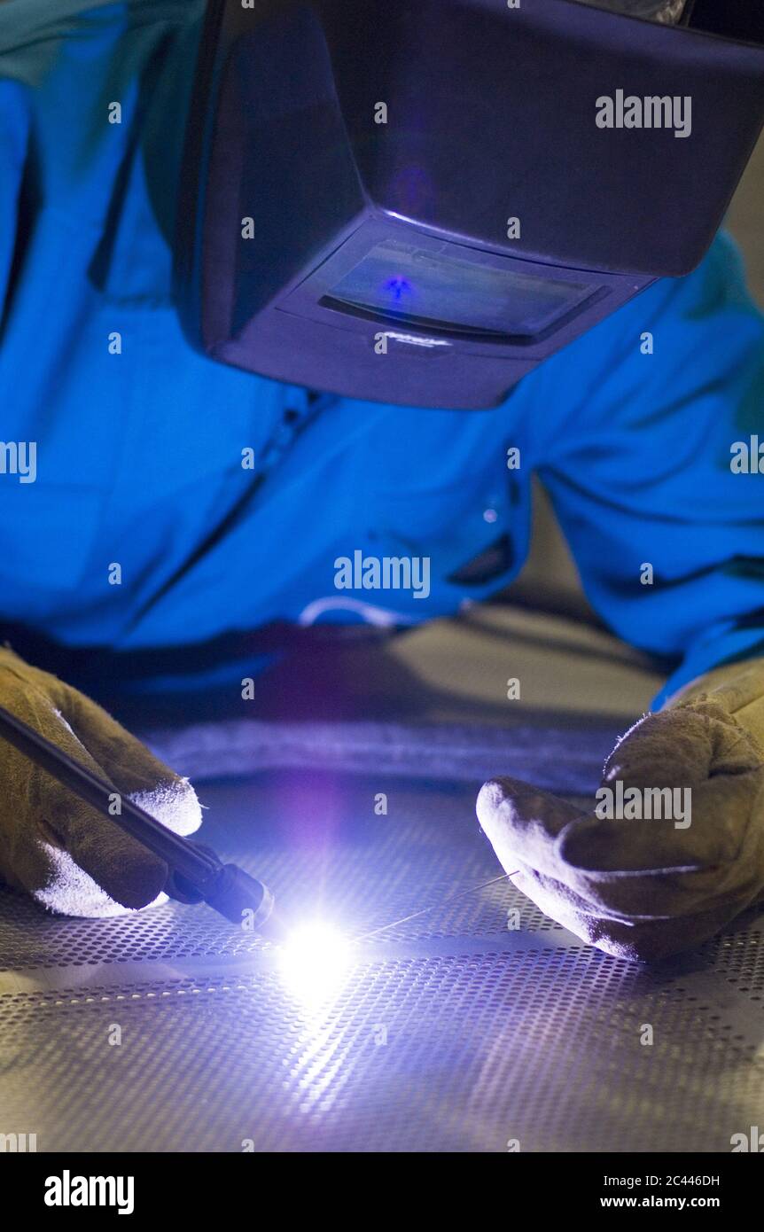 Man welder in blue hi-res stock photography and images - Alamy