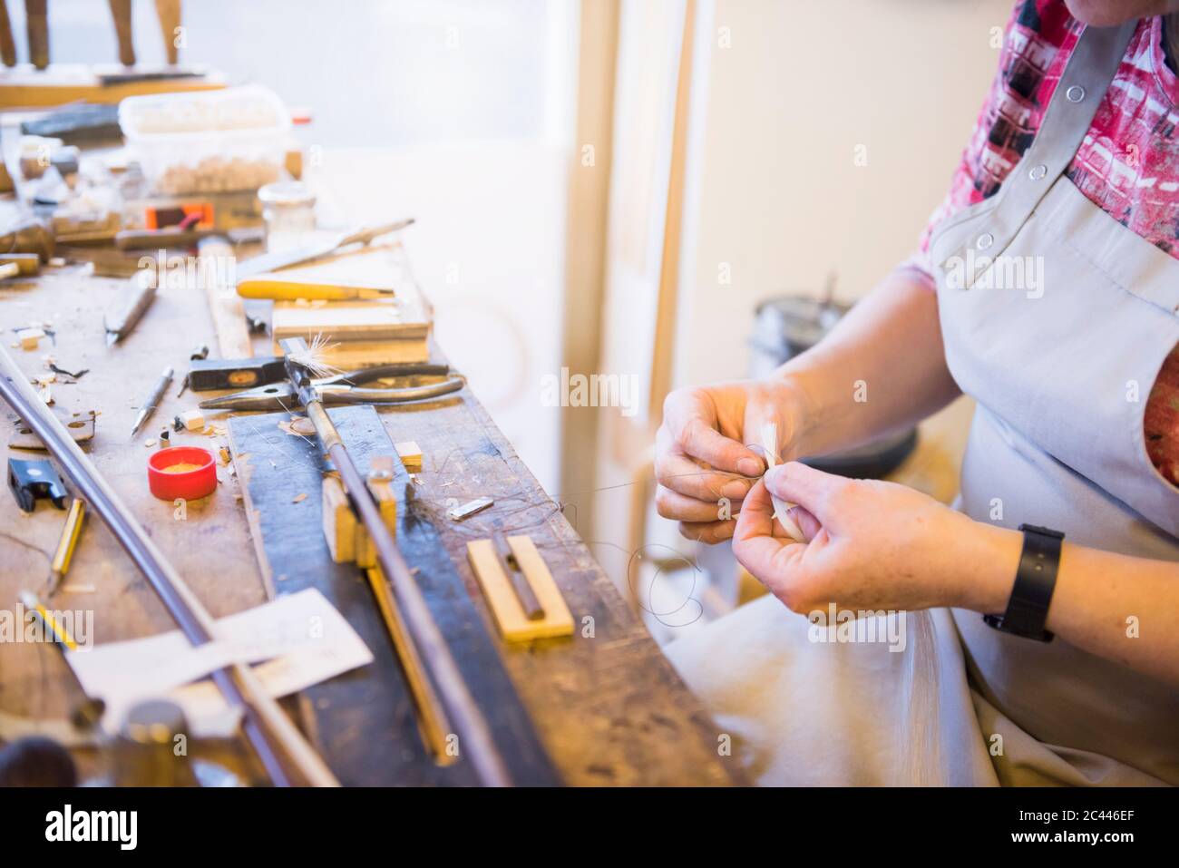 Female violin maker at work Stock Photo - Alamy