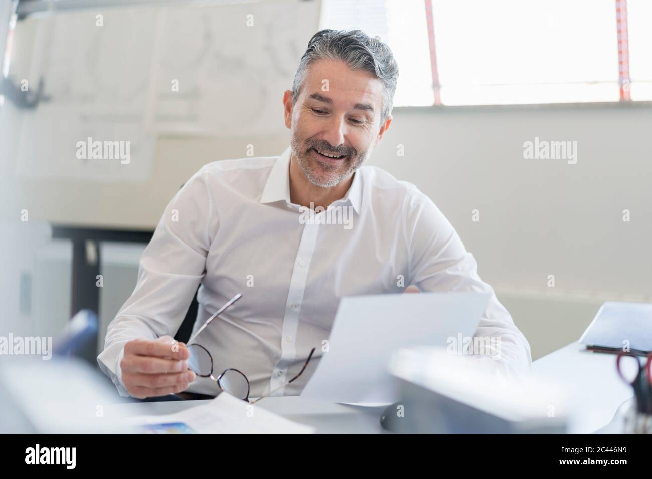 Handsome professional sitting desk working hi-res stock photography and ...