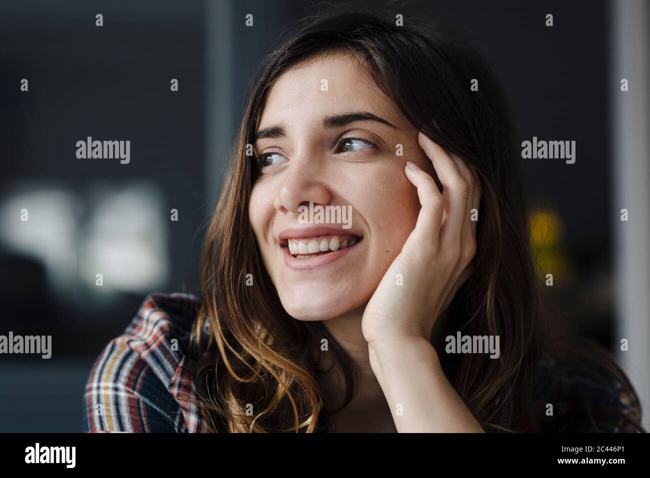 Portrait of happy young woman looking at distance Stock Photo - Alamy