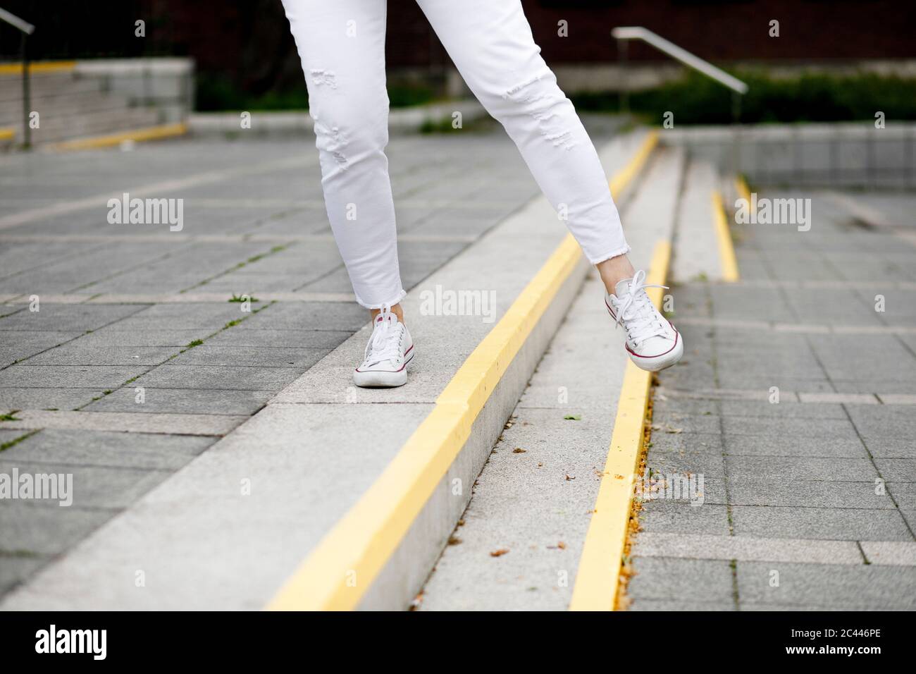 Woman standing on steps hi-res stock photography and images - Alamy