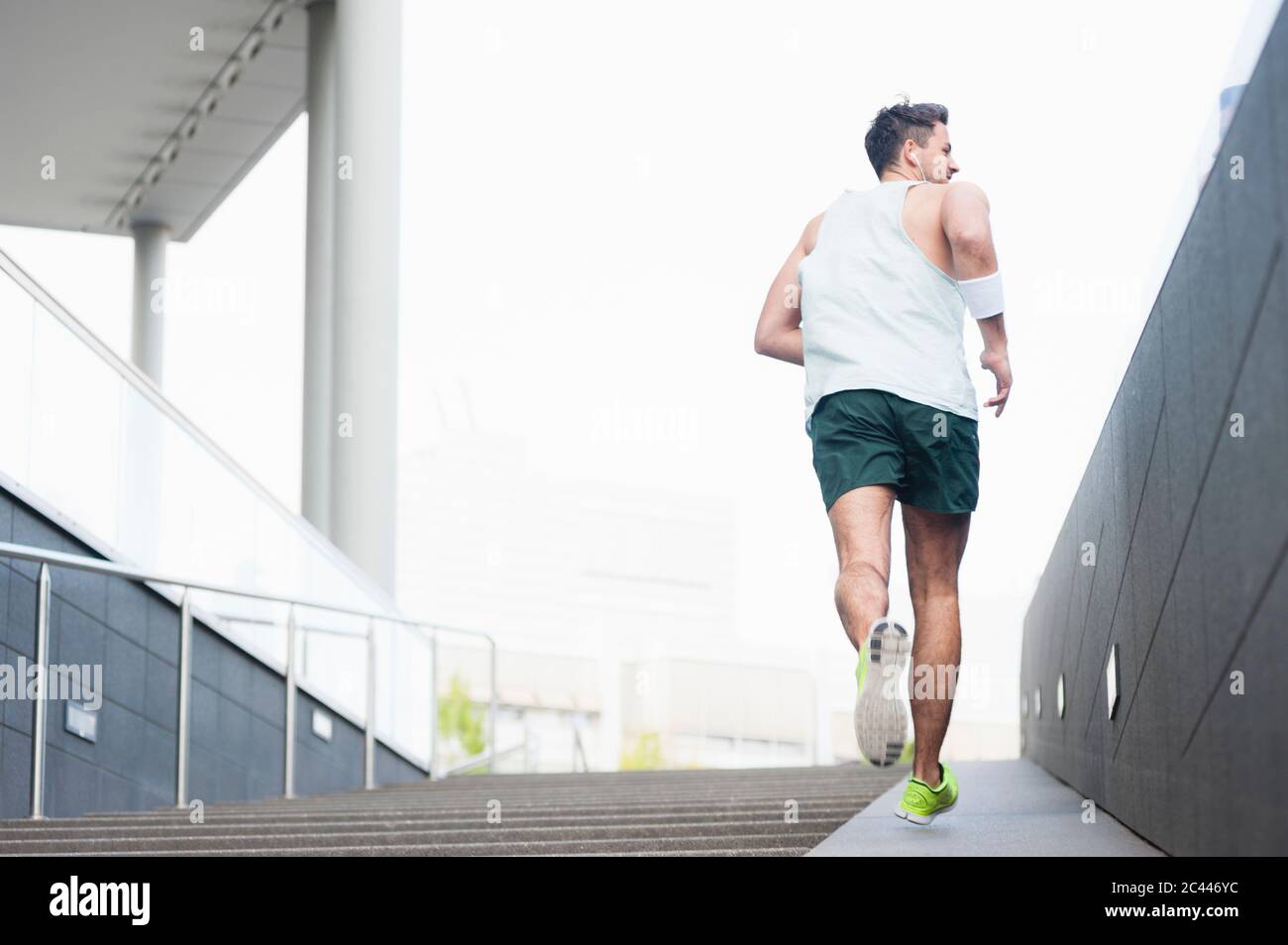 Rear view of man jogging hi-res stock photography and images - Alamy