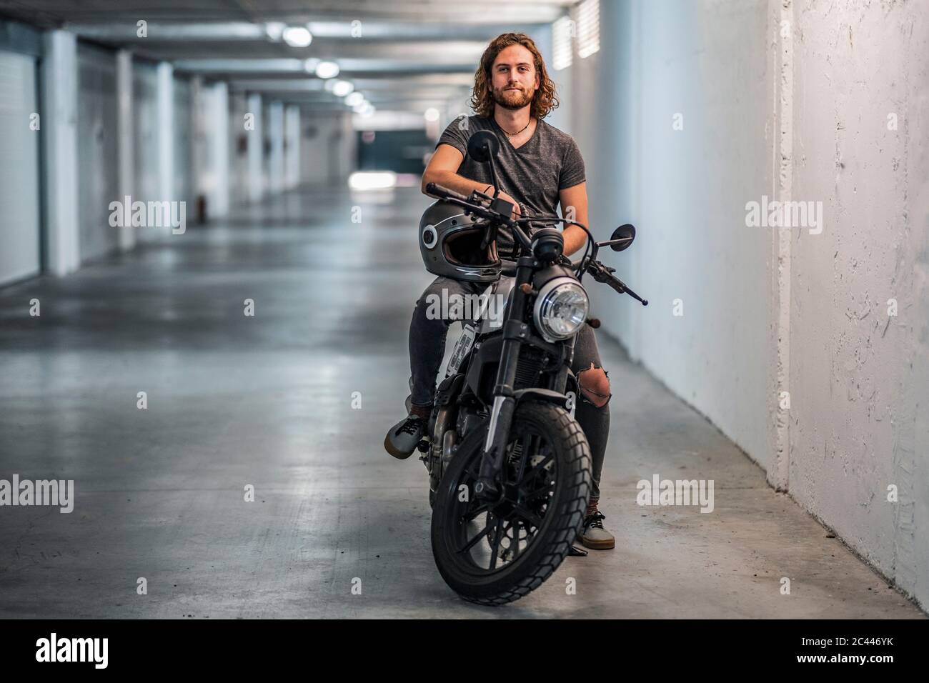 Young man on motorcycle Stock Photo - Alamy