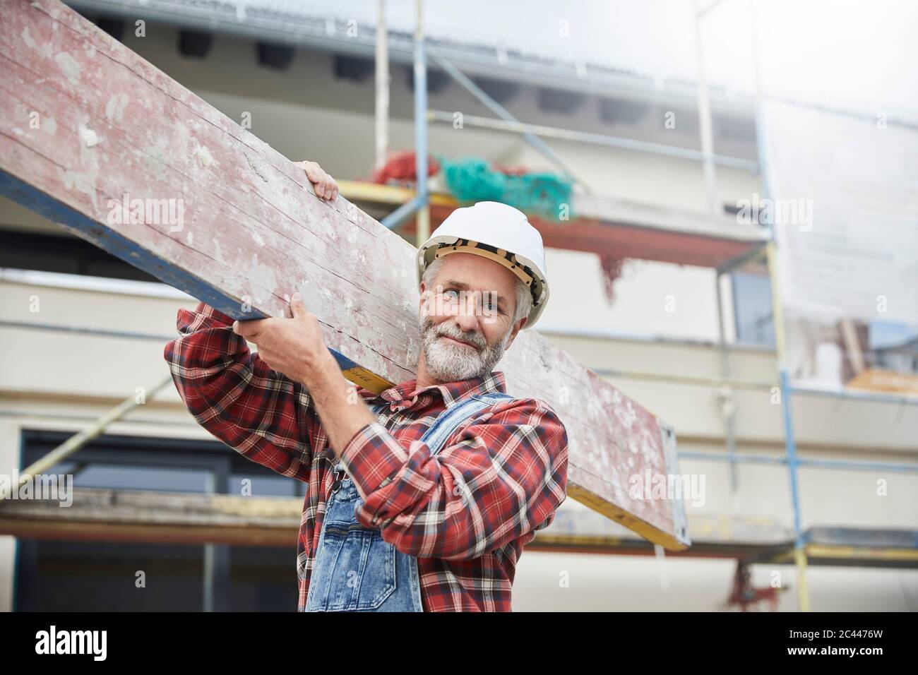 Construction worker working at construction site Stock Photo - Alamy