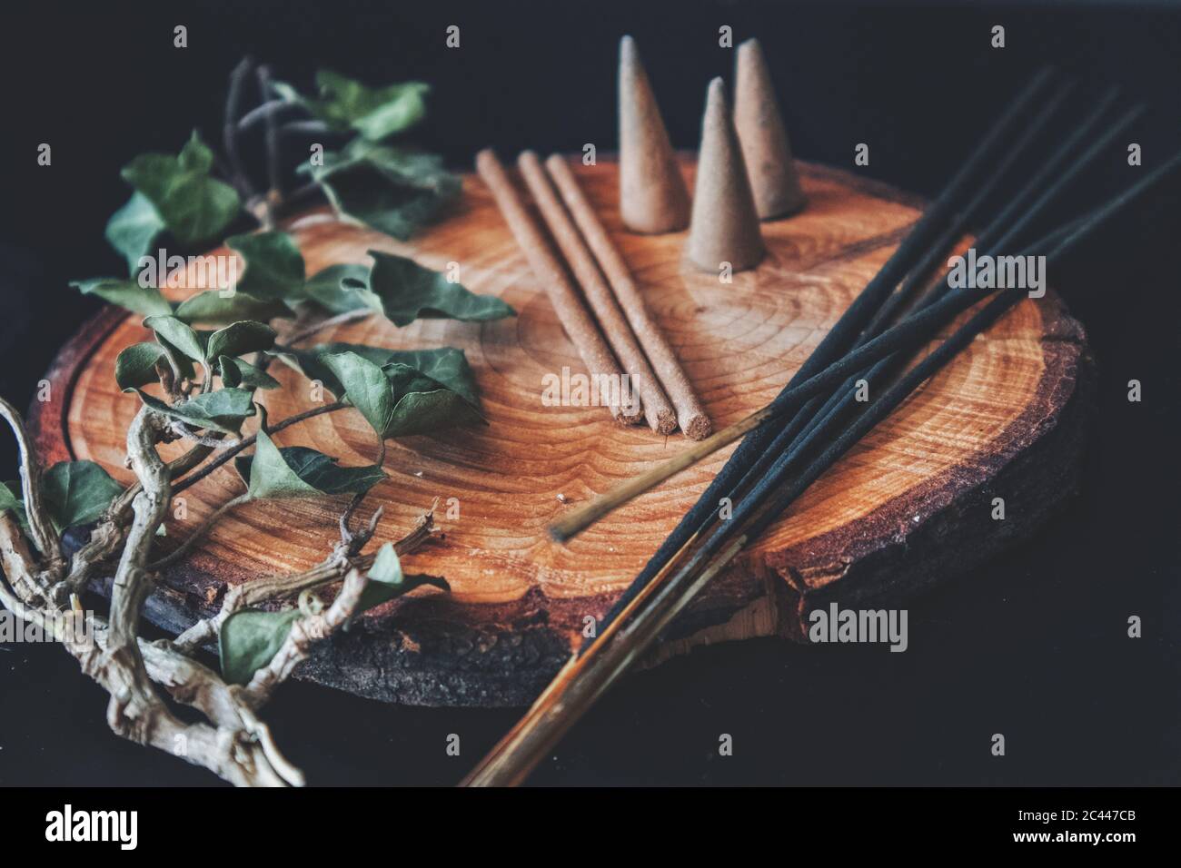Examples of various types of incense - long black sticks, short hand ...