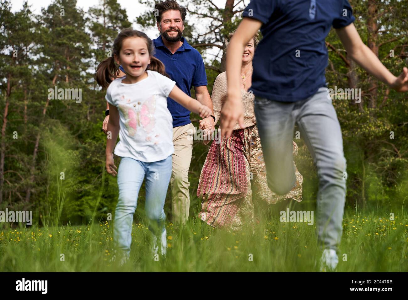 Running group four adults hi-res stock photography and images - Alamy