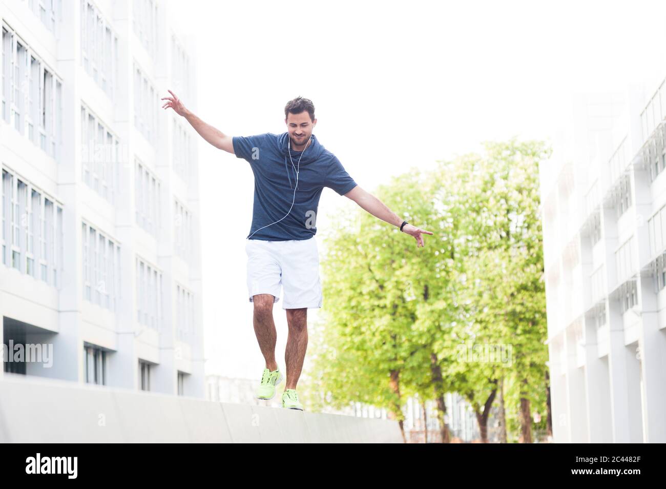 Balancing athlete in blue hi-res stock photography and images - Alamy