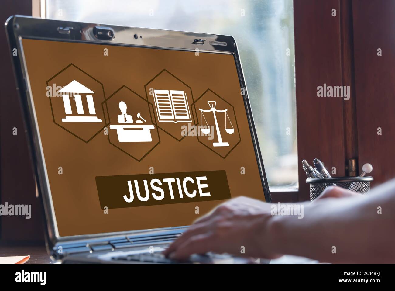Laptop screen displaying a justice concept Stock Photo - Alamy