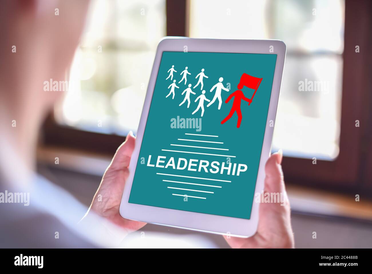 Tablet screen displaying a leadership concept Stock Photo - Alamy