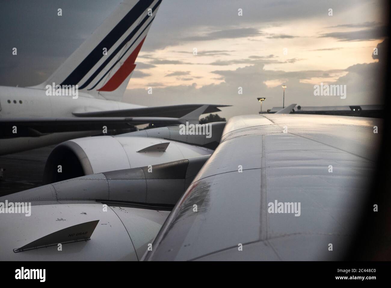 South Africa, Johannesburg, Wing and engine of airplane on tarmac Stock ...
