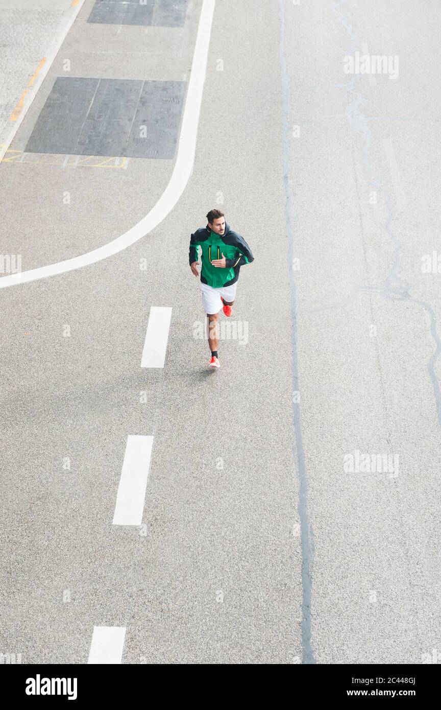 Bird's eye view of young man running on a road Stock Photo - Alamy