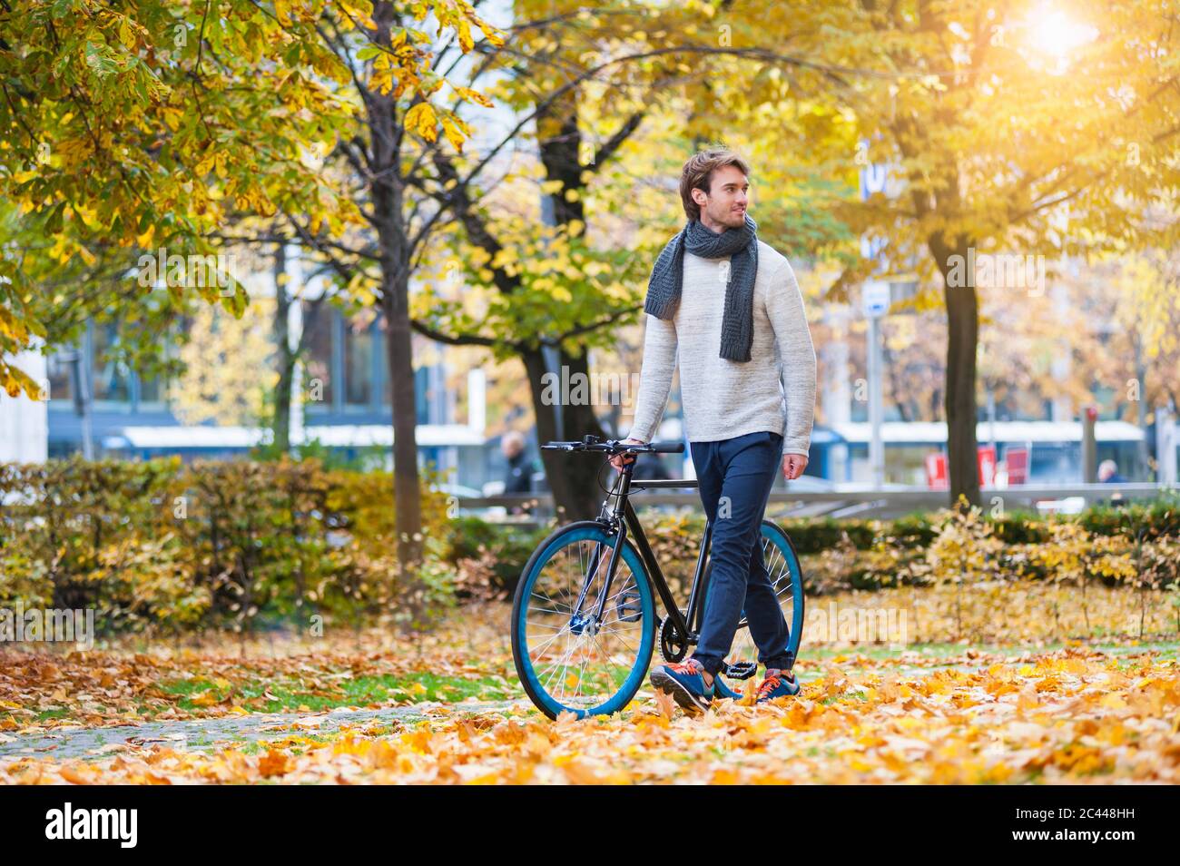 Man pushing his bicycle hi-res stock photography and images - Alamy