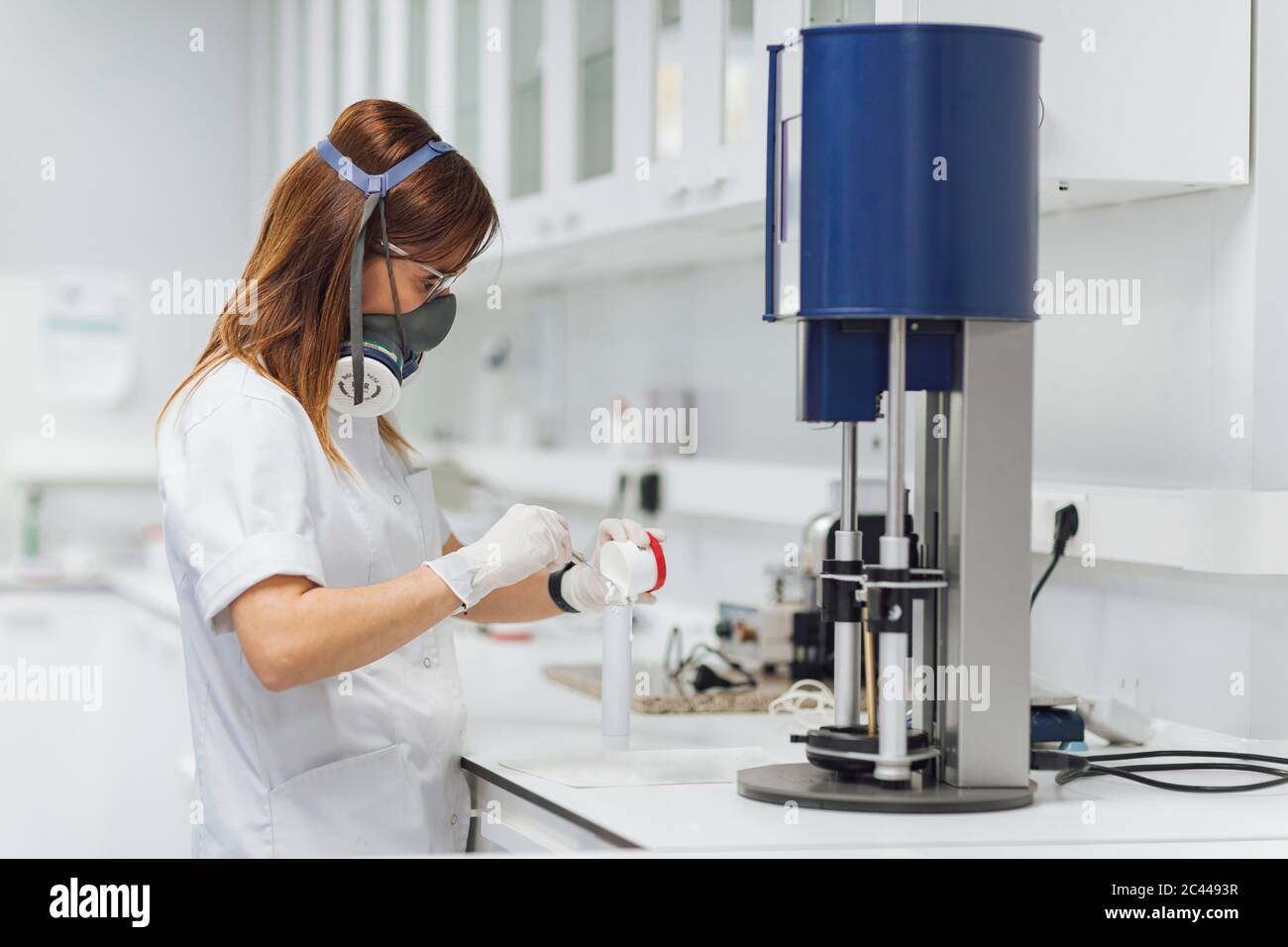 Mature female healthcare worker preparing for research at lab Stock ...