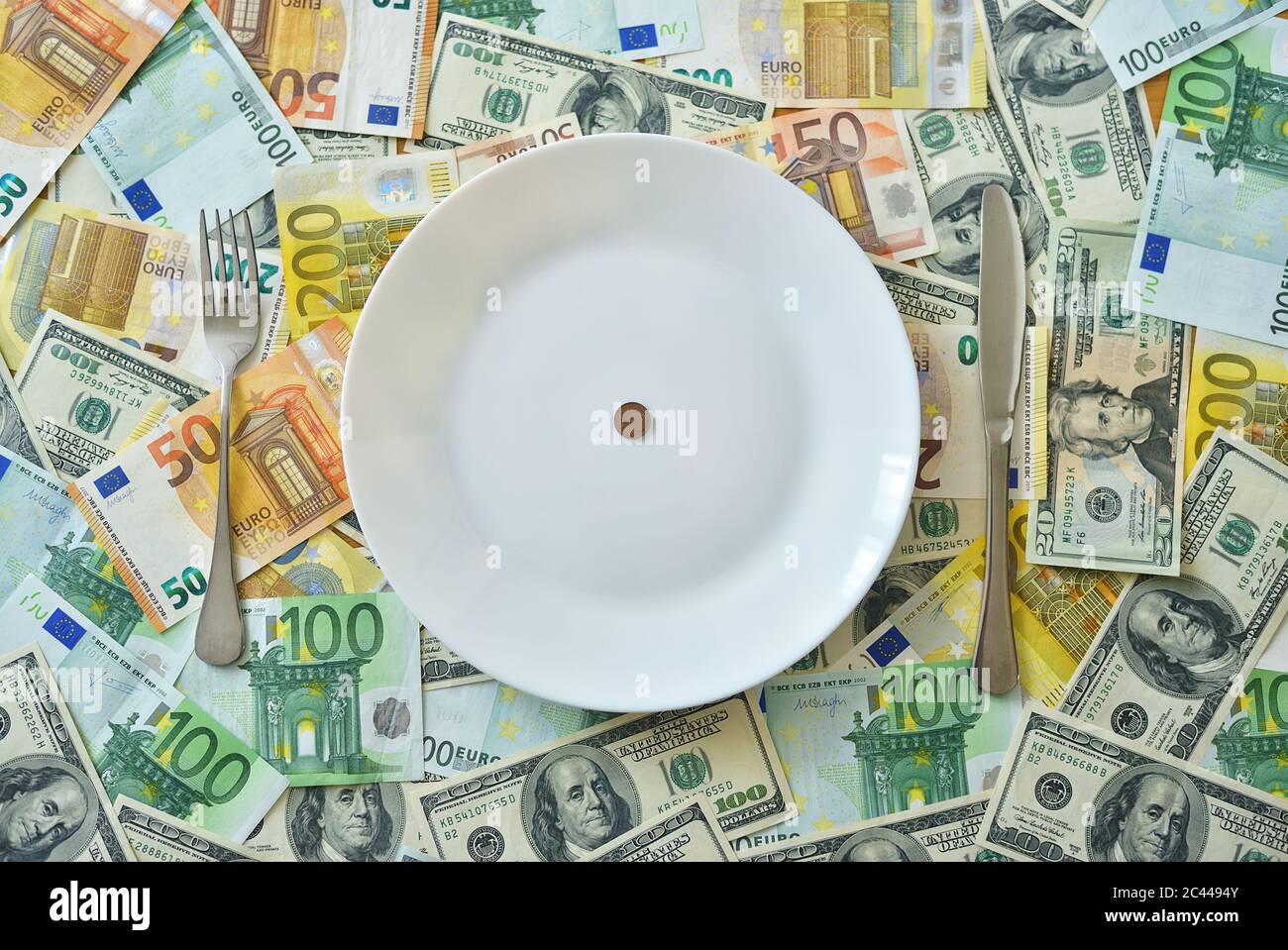 Euro coin on knife hi-res stock photography and images - Alamy