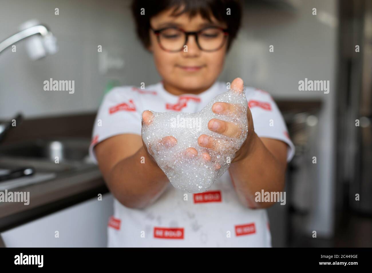 Boy with foam in his hands Stock Photo - Alamy