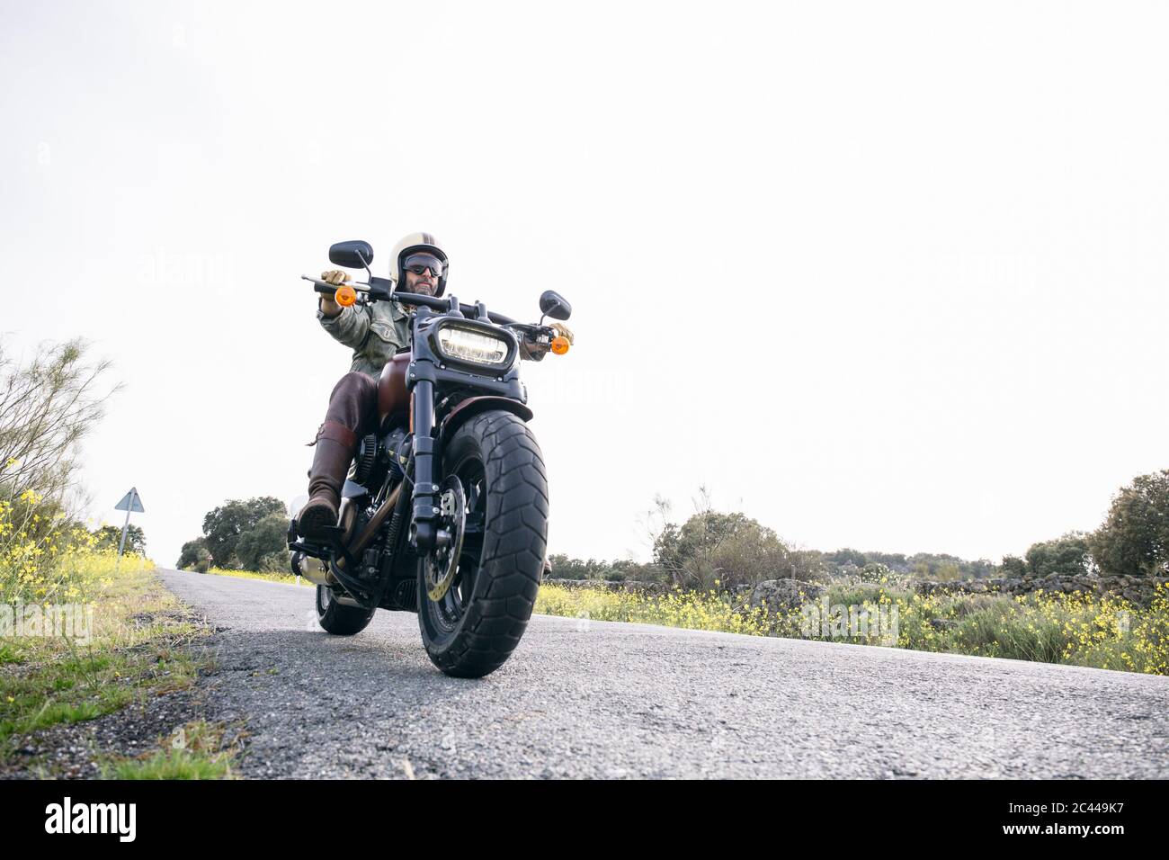 Biker riding motorcycle low angle hi-res stock photography and images ...