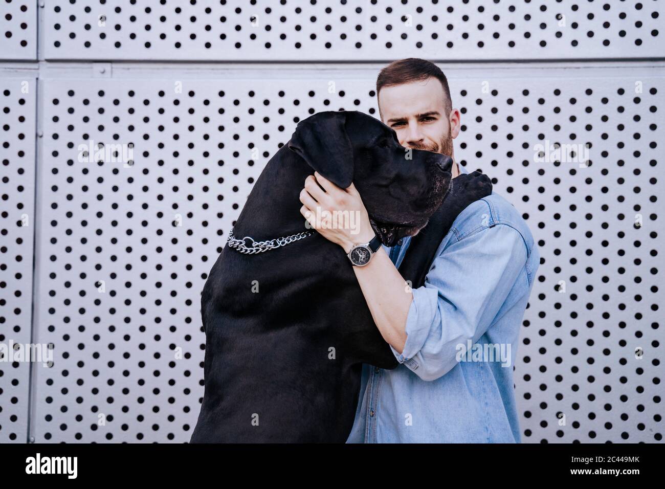 Cuddling dog man hi-res stock photography and images - Alamy