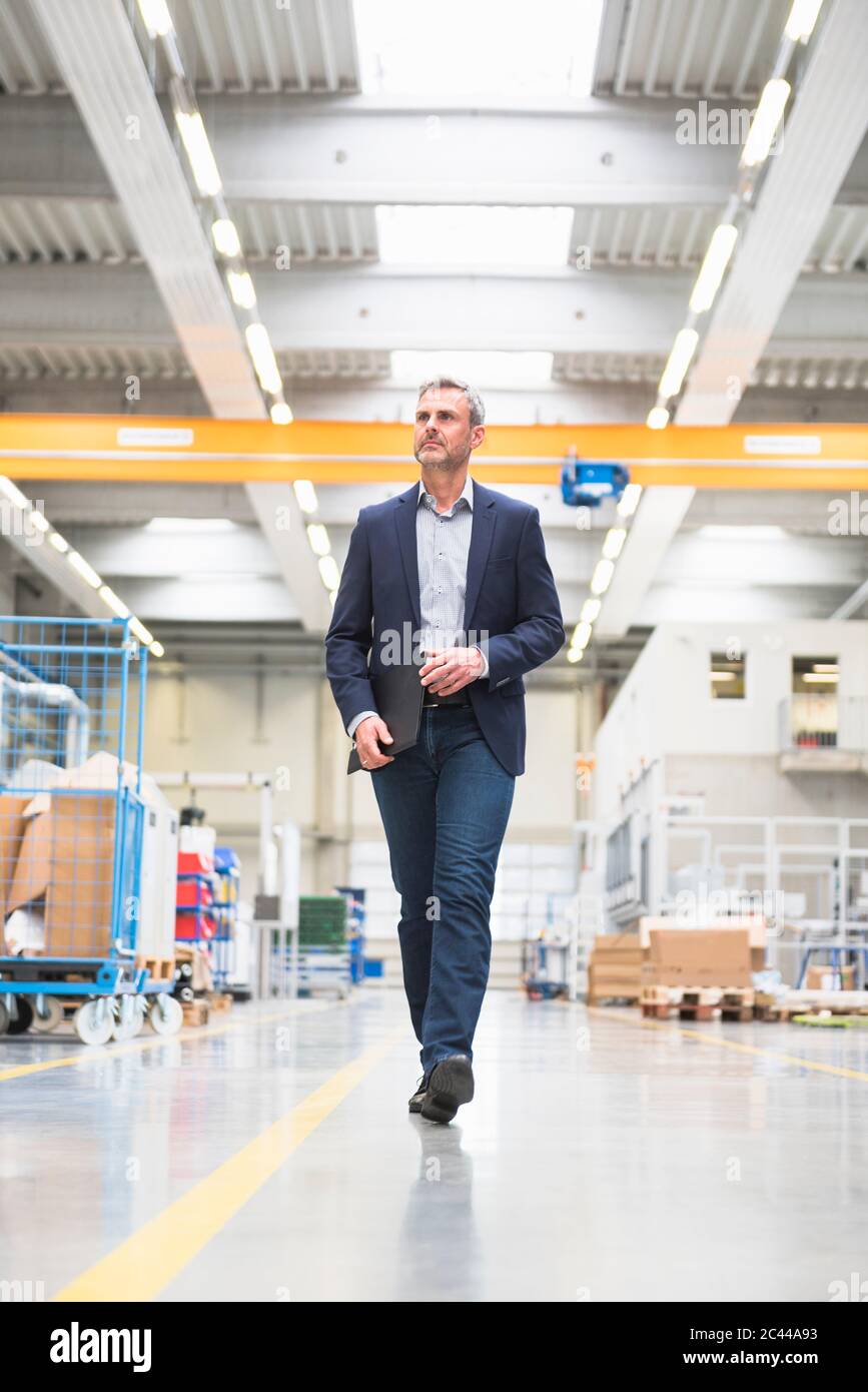 Businessman walking factory workshop hi-res stock photography and ...
