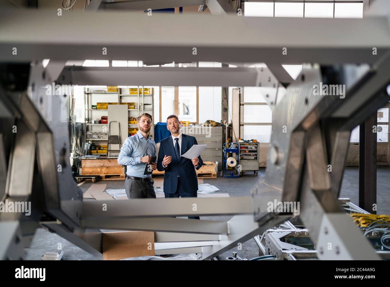 Two businessmen having a meeting in a factory Stock Photo - Alamy