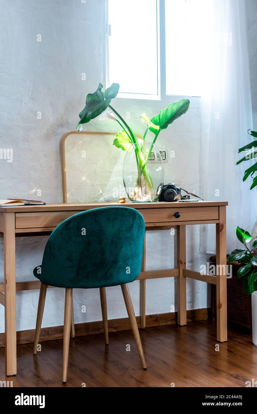 Chair and desk against window in bedroom at home Stock Photo - Alamy