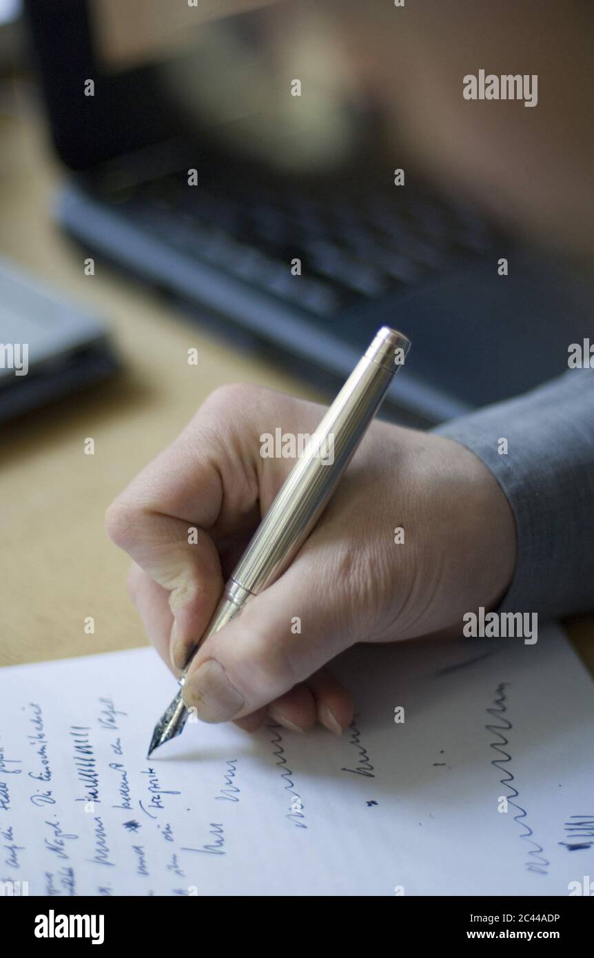 Hand writes with fountain pen on paper Stock Photo - Alamy