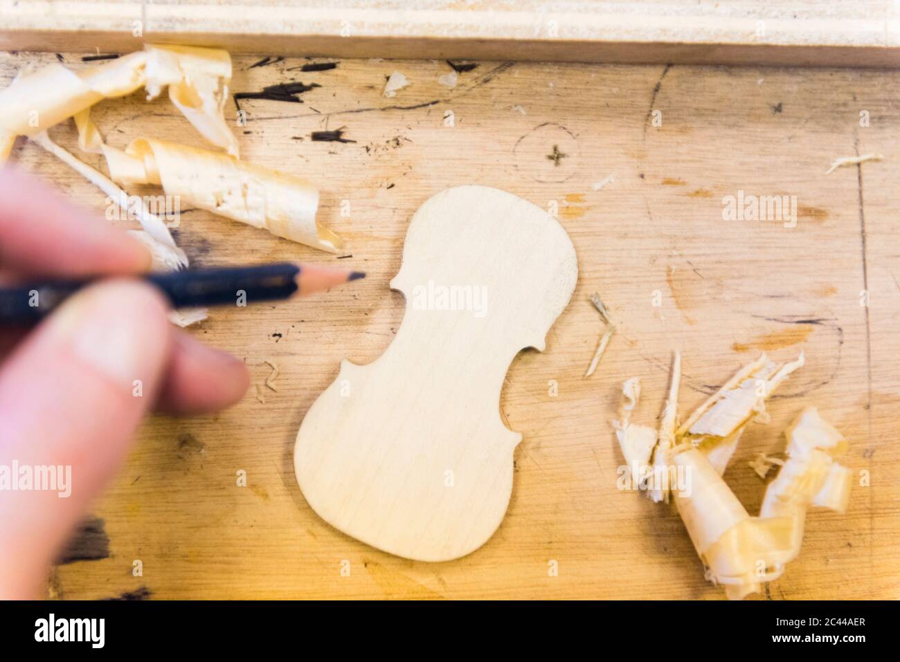 Female violin maker at work, model Stock Photo - Alamy