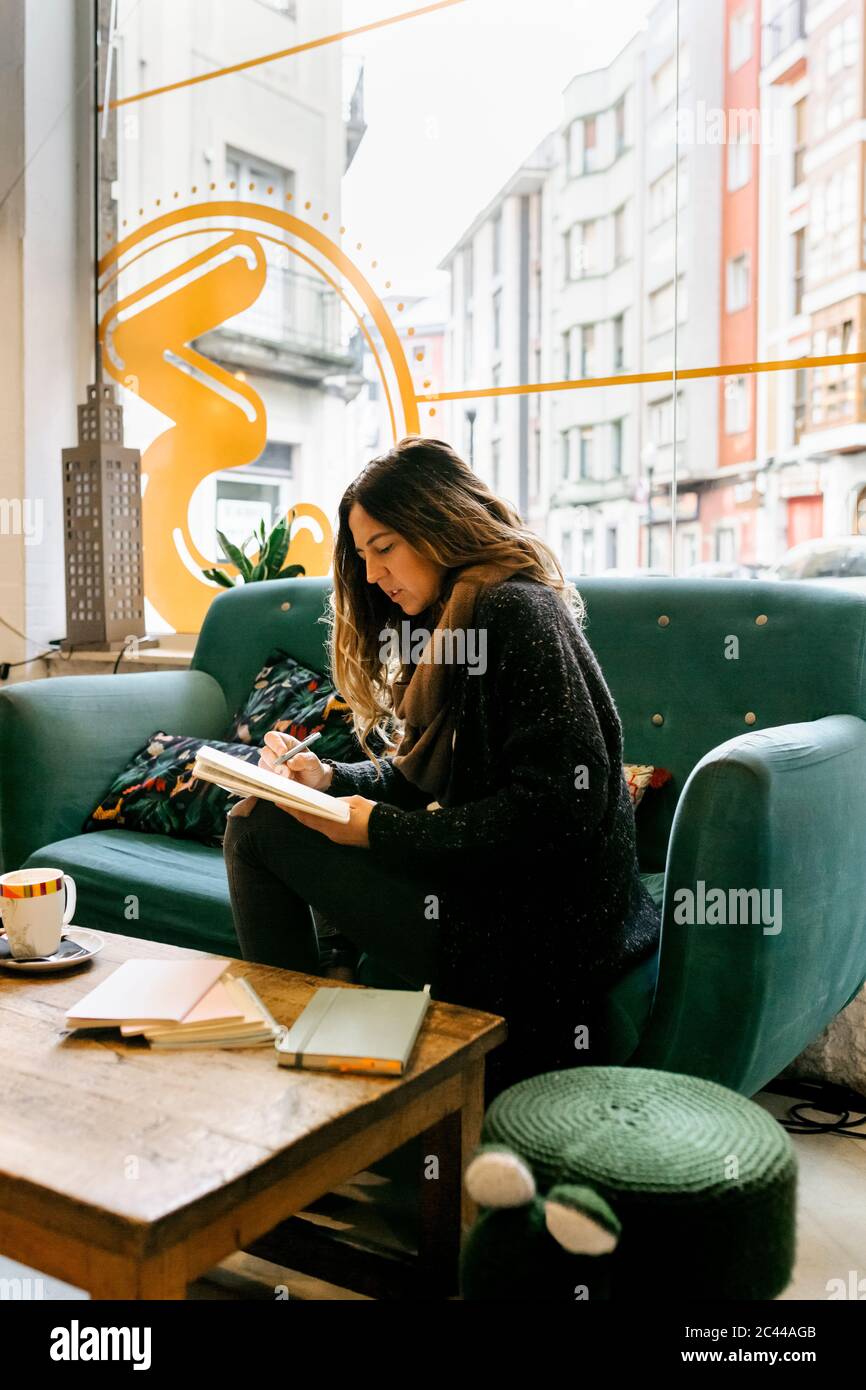 Woman working in coffee shop hi-res stock photography and images - Alamy