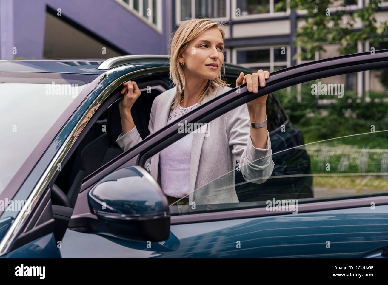 Portrait of car driver looking at distance Stock Photo - Alamy