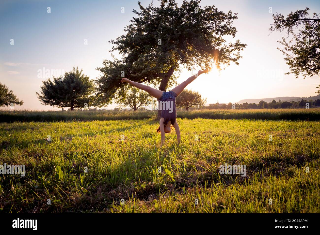 Girl doing handstand hi-res stock photography and images - Alamy