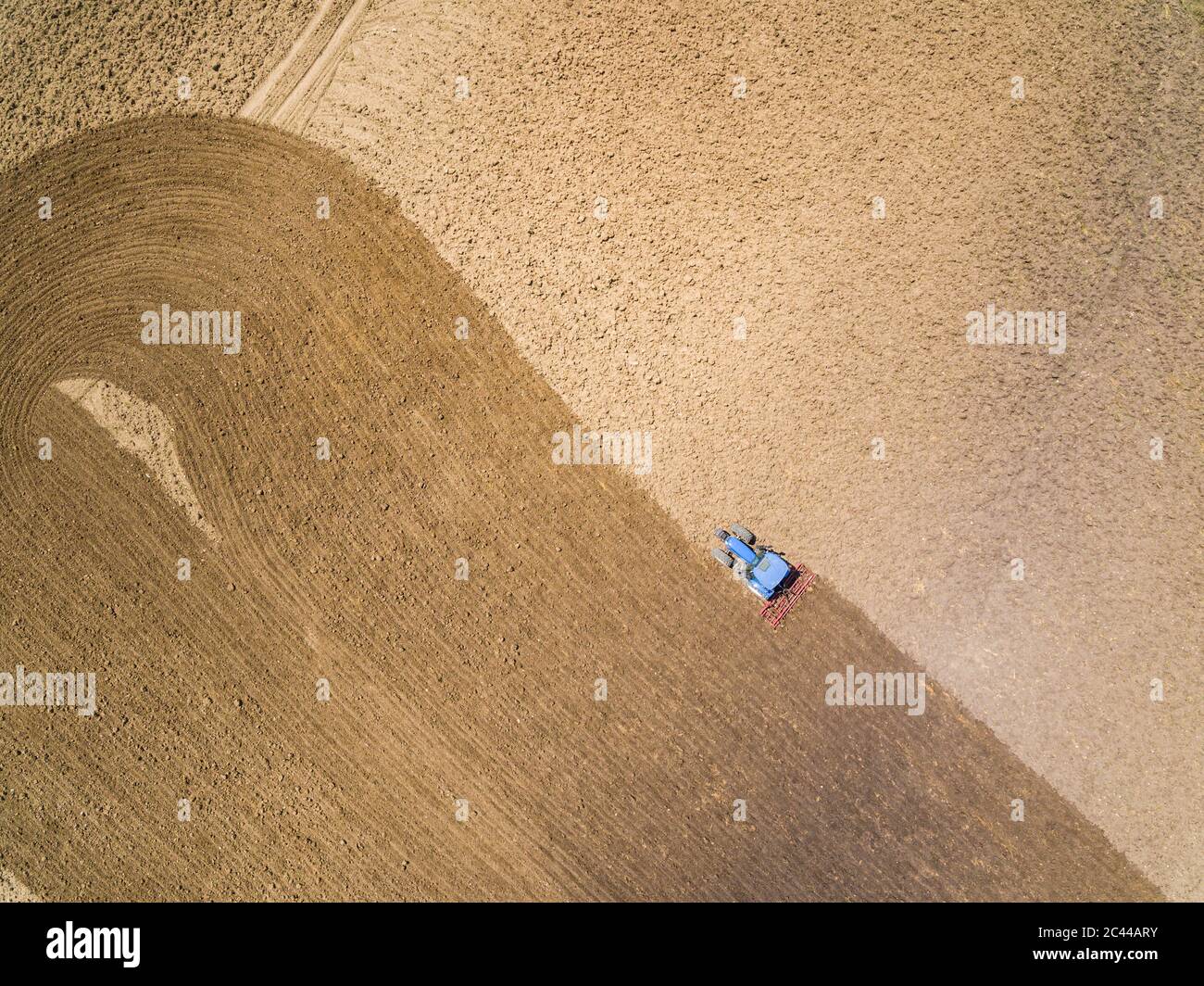 Aerial view of tractor in farm, Italy Stock Photo - Alamy