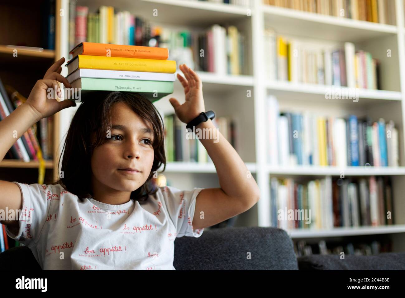 Balancing books on head hi-res stock photography and images - Alamy Balancing books on head hi-res stock photography and images - Alamy