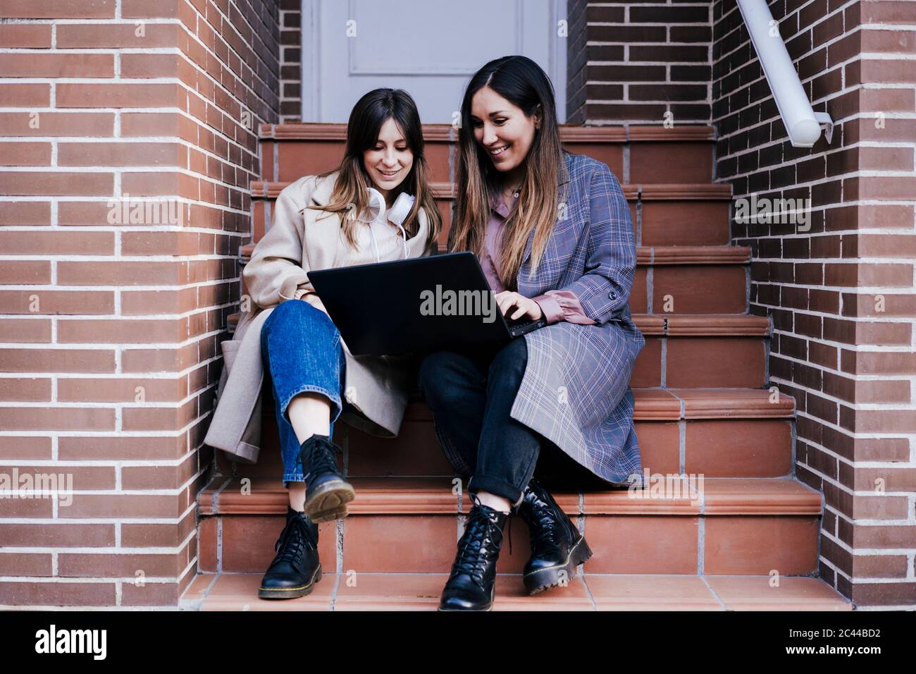 Women on stairs hi-res stock photography and images - Alamy