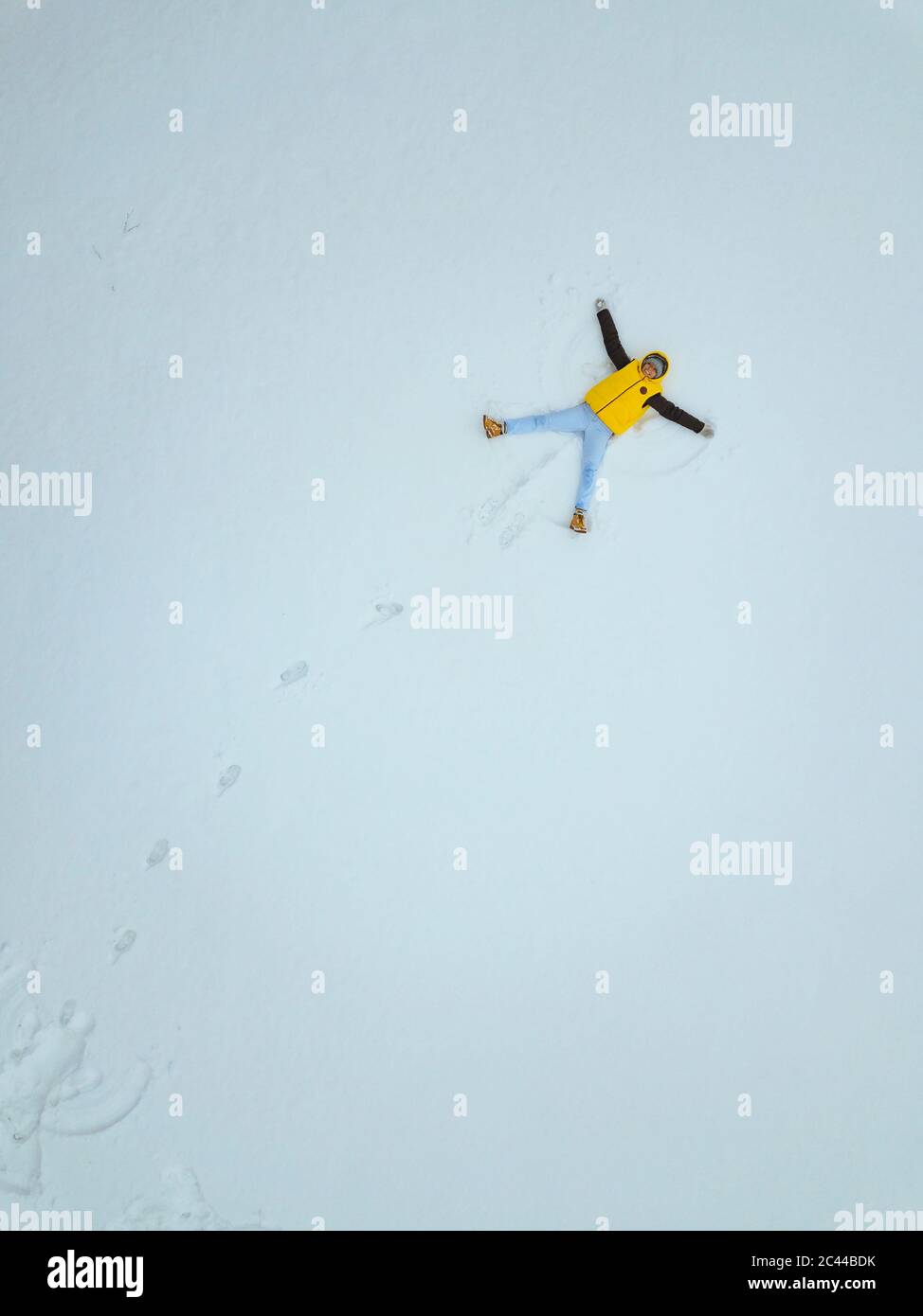 Russia, Aerial view of adult woman making snow angel Stock Photo - Alamy