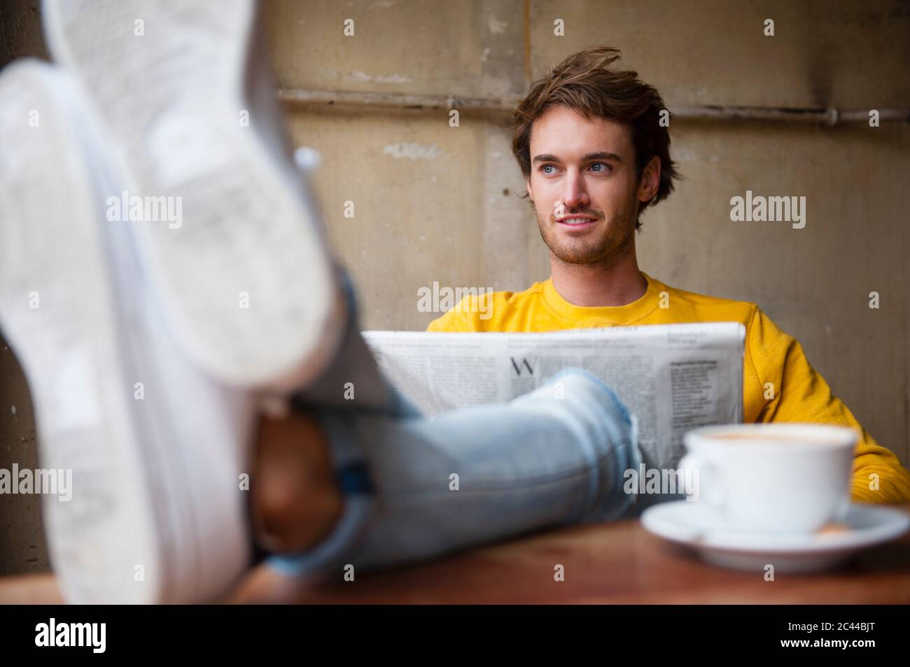 Young man feet up hi-res stock photography and images - Alamy