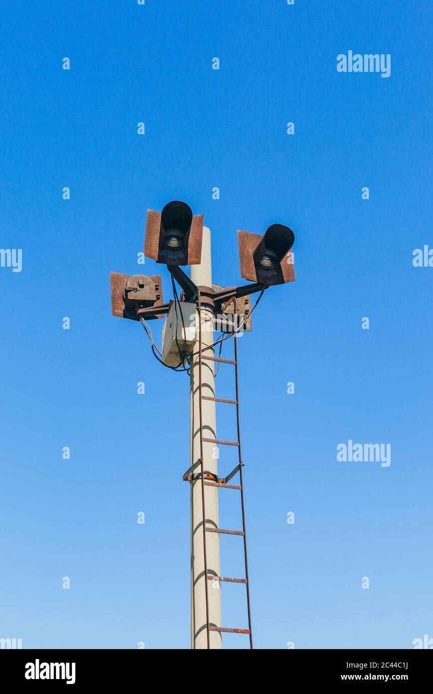 Rusty railroad lights and blue sky outdoors Stock Photo - Alamy