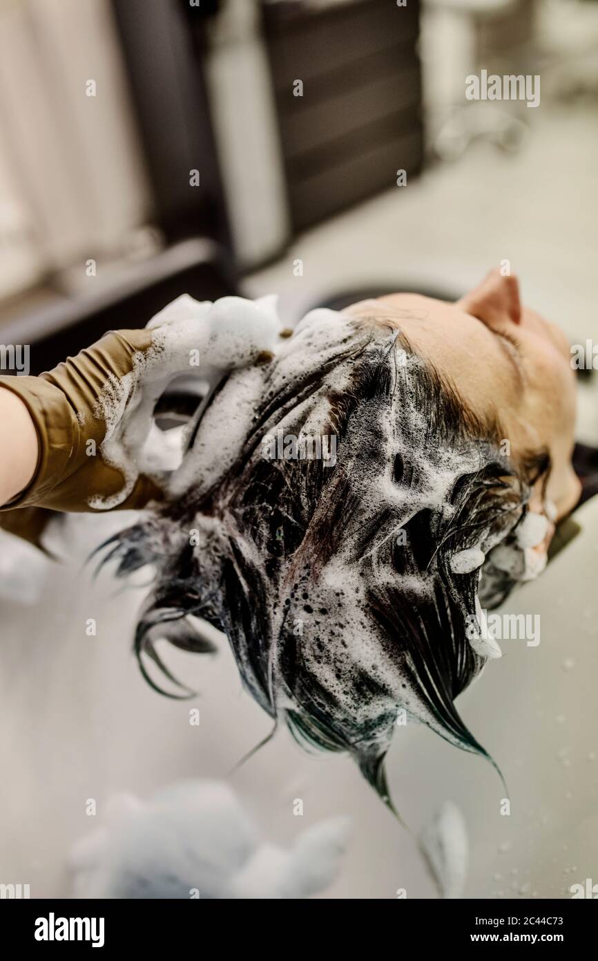 Woman washing her hair foam hi-res stock photography and images - Alamy