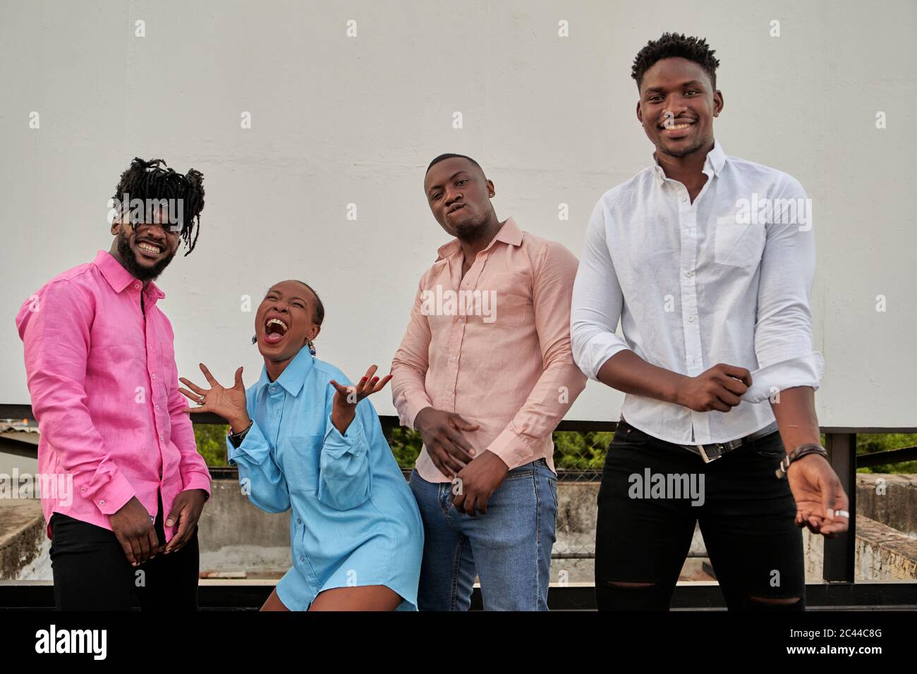 Portrait of friends posing outdoors Stock Photo - Alamy