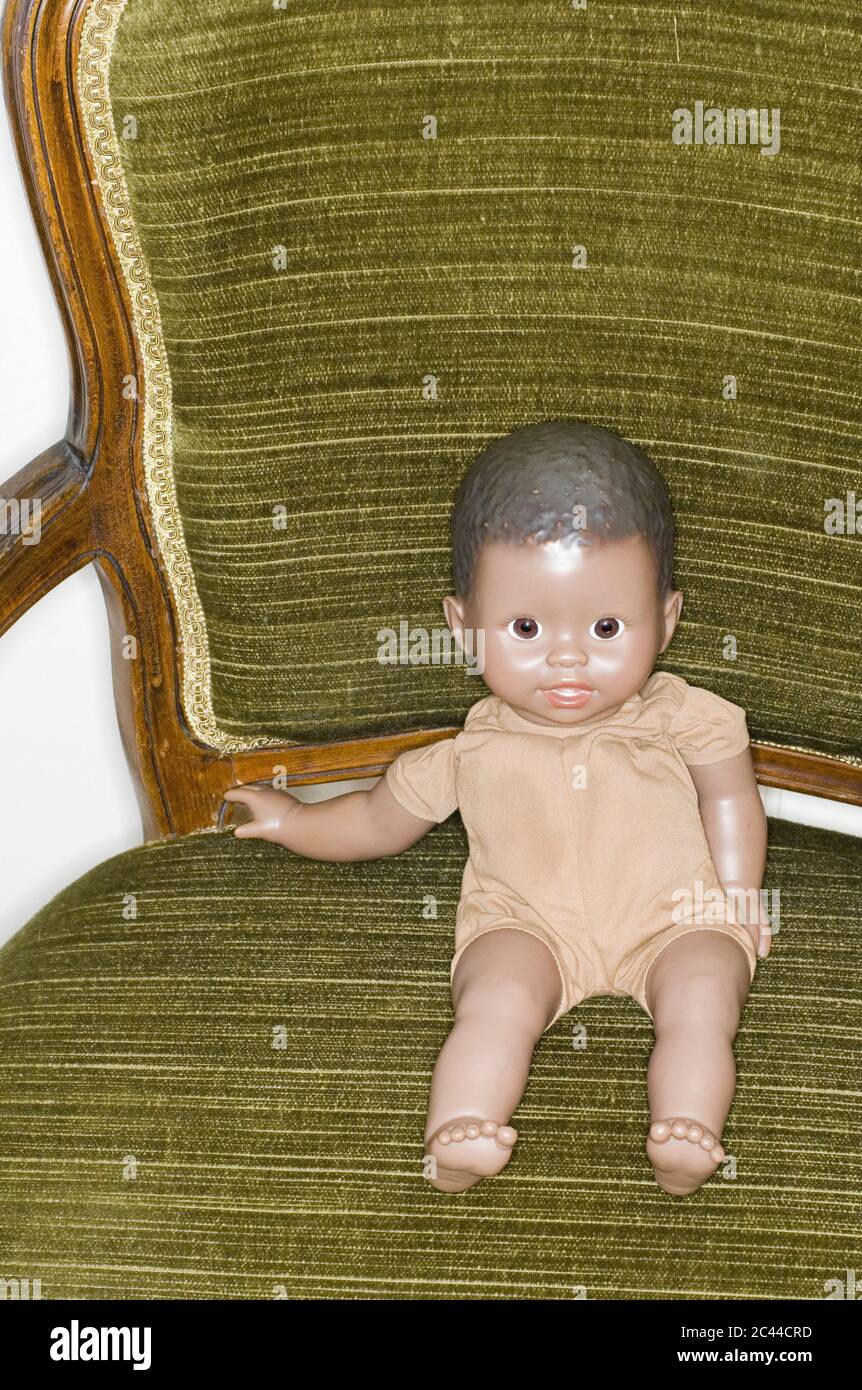 Doll sitting on chair hi-res stock photography and images - Alamy
