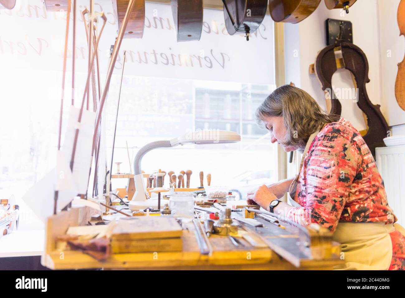 Female violin maker at work in her workshop Stock Photo - Alamy