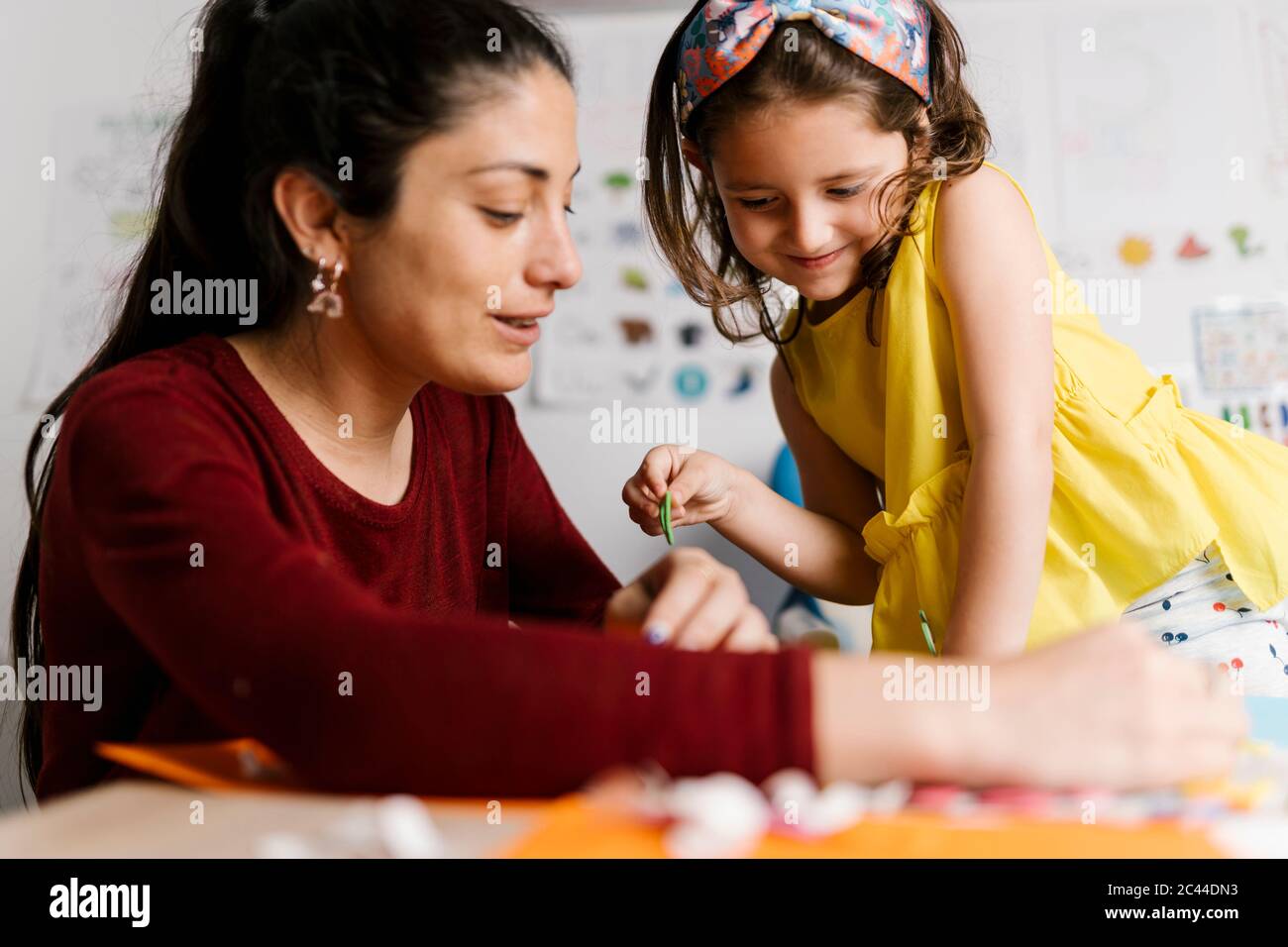 Mother and daughter doing crafts at home Stock Photo - Alamy