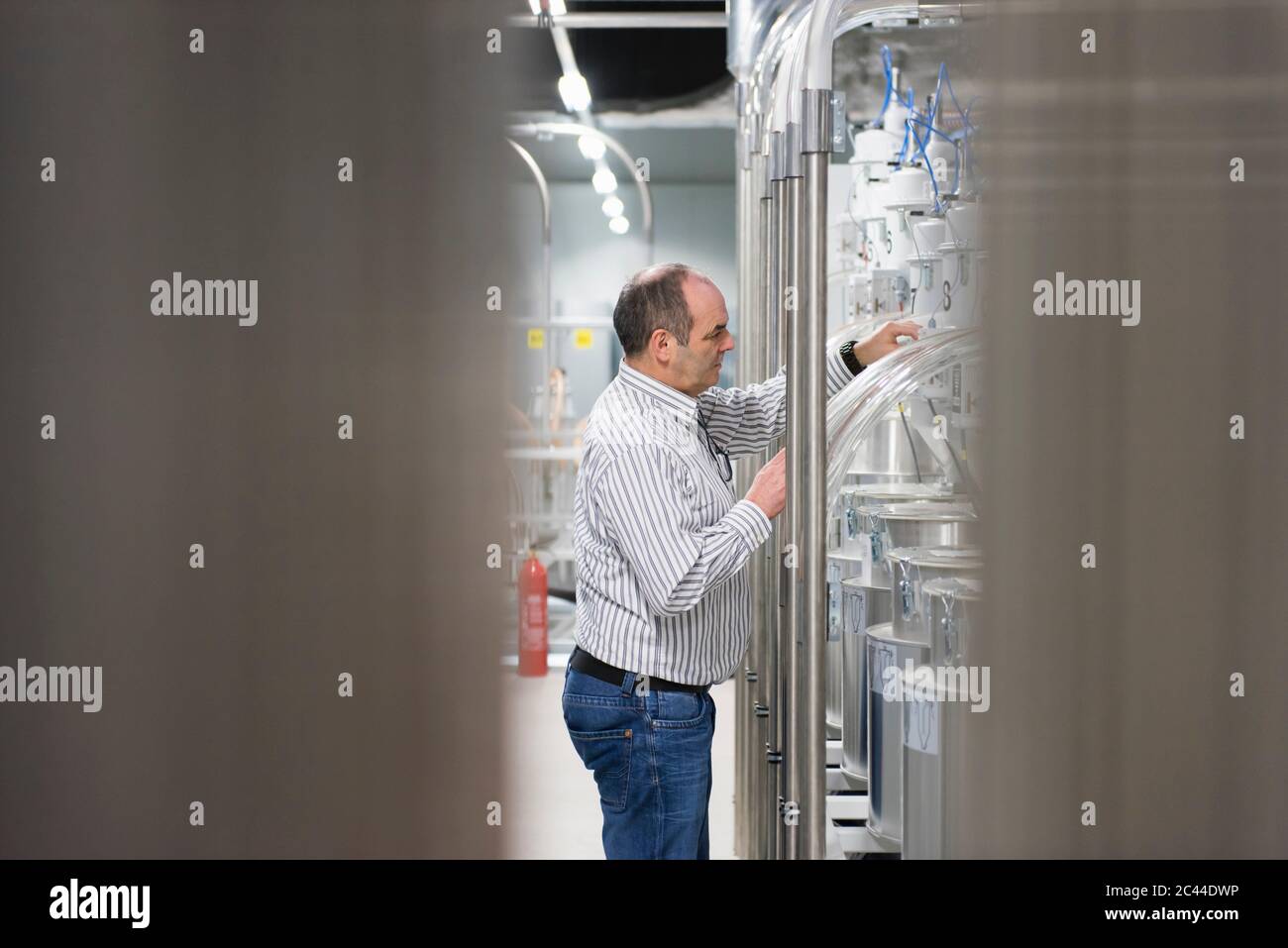 Man and machinery hi-res stock photography and images - Alamy